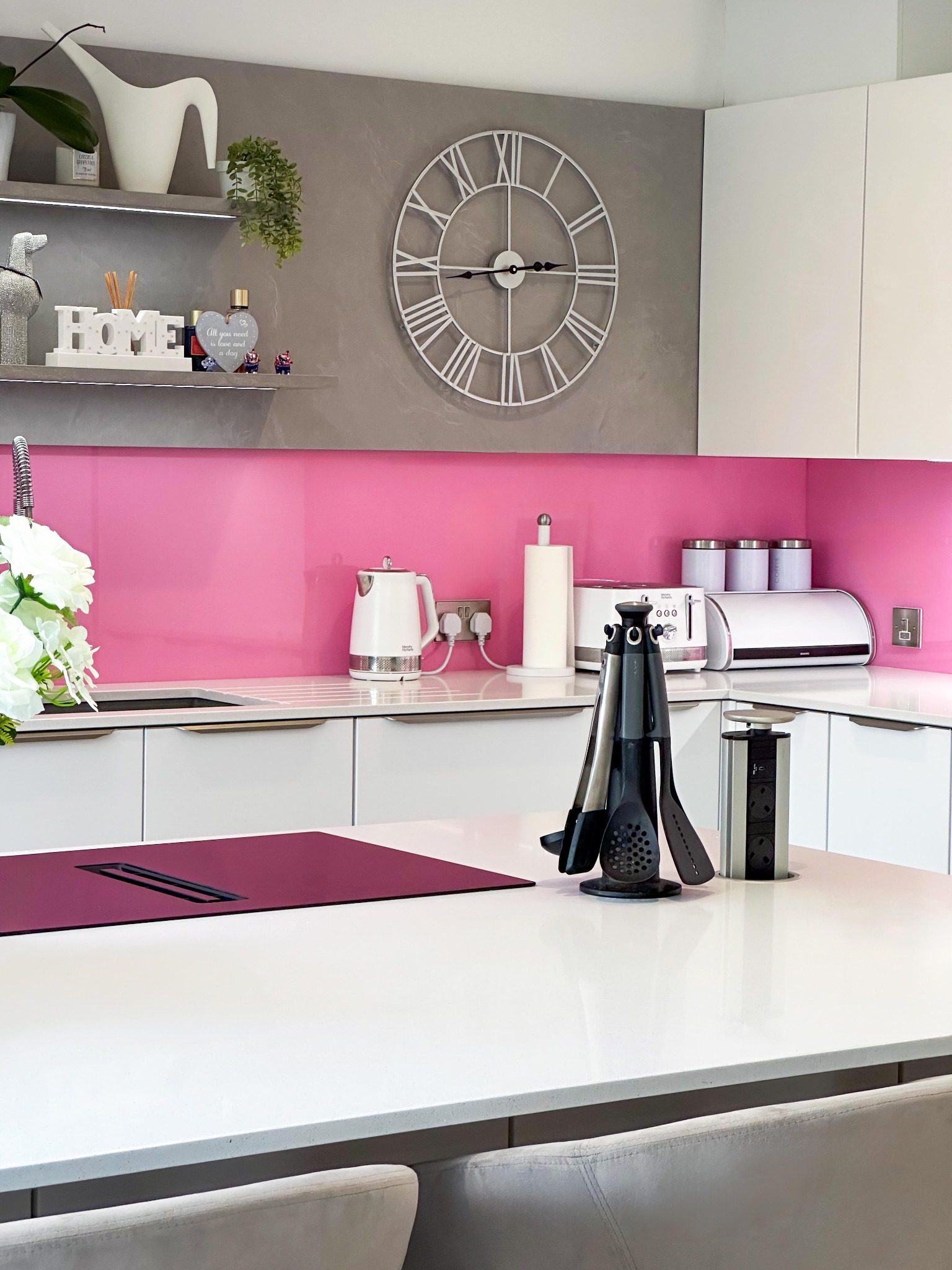 Modern White Kitchen with Pink Glass Backsplash, Spacious Island, and ...